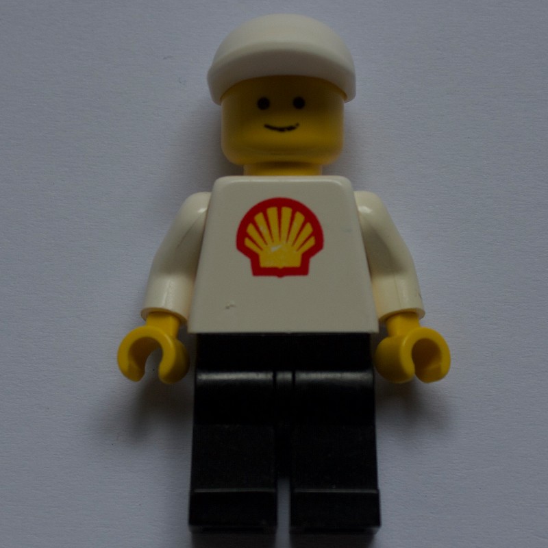 LEGO Set fig-008812 Man, White Torso with Shell Logo, Black Legs, White ...